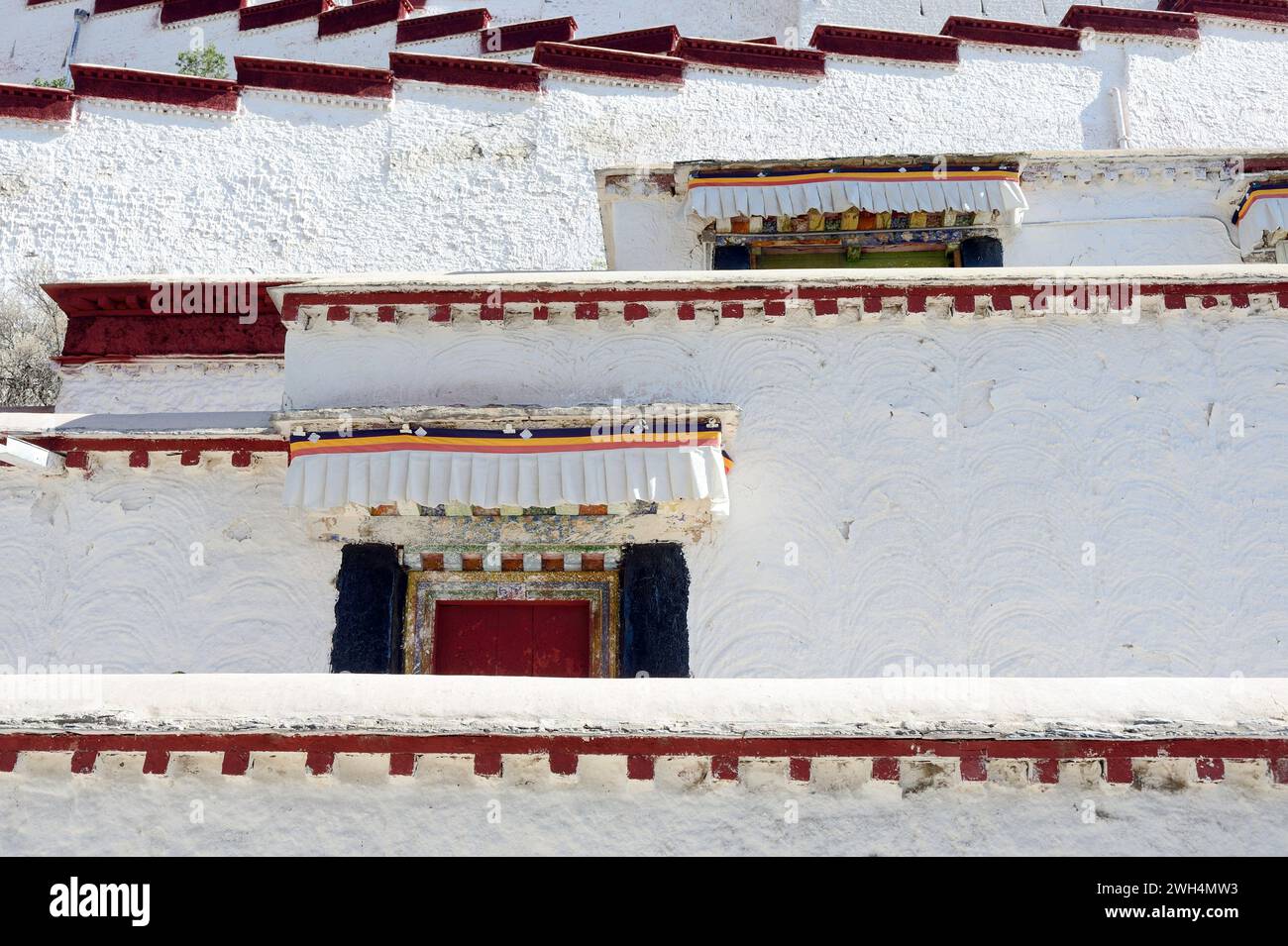Weathered windows line Potala Palace, once home to the Dalai Lama. The ...