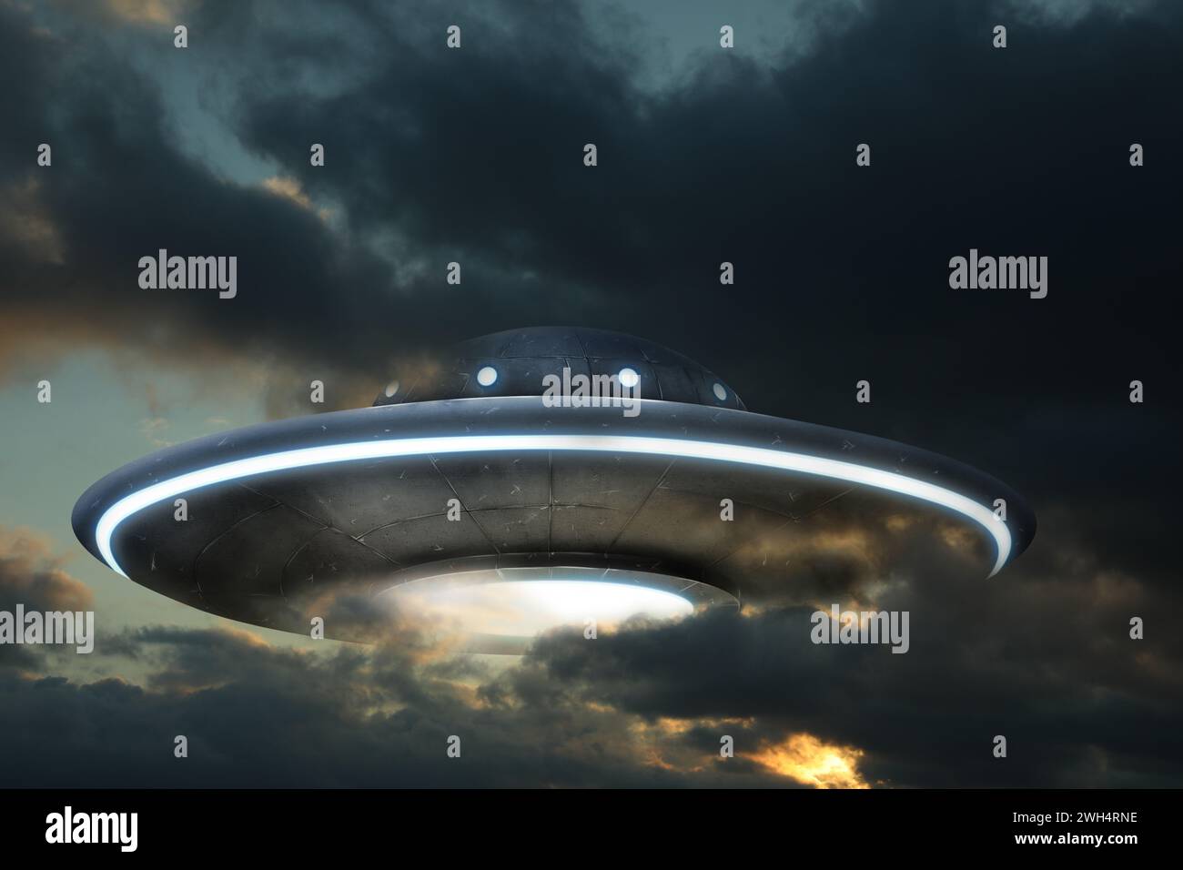 UFO. Alien spaceship among clouds in sky. Extraterrestrial visitors ...