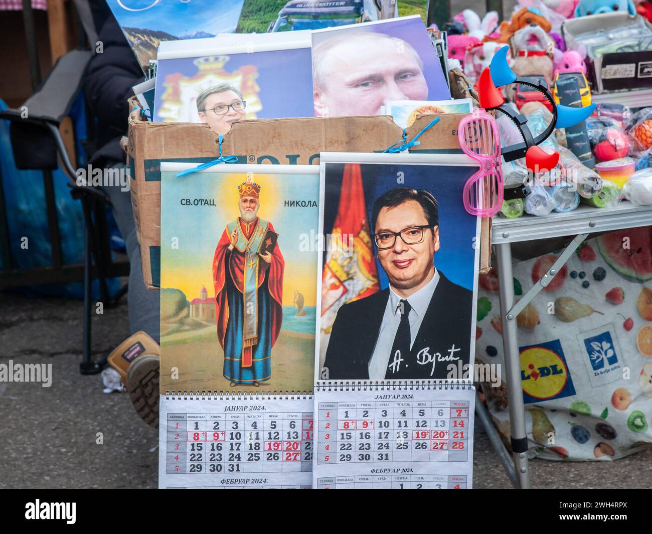 Picture of various calendars for sale on a market in Rumenka, Serbia ...