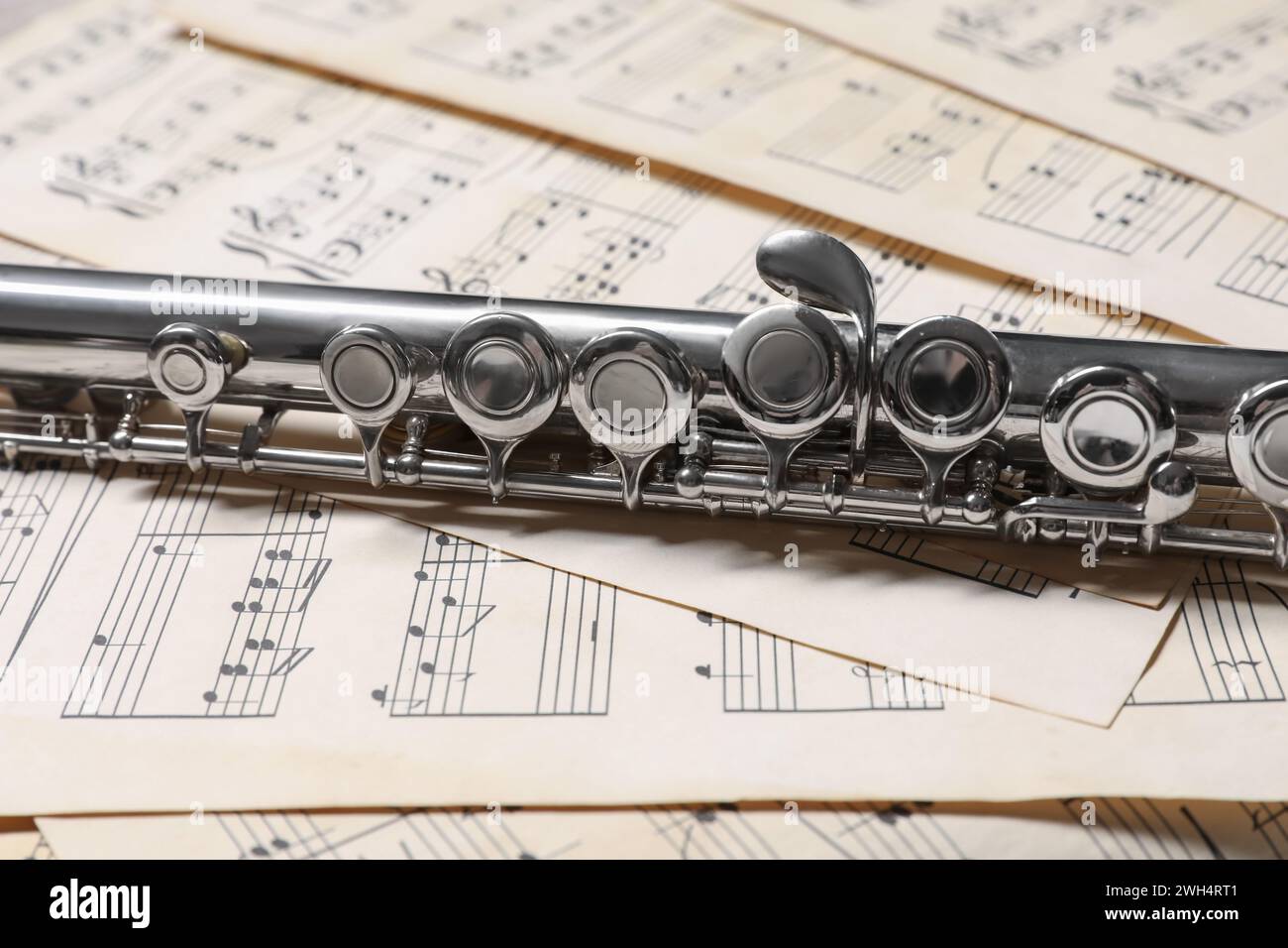 Classical flute on sheets with musical notes, closeup Stock Photo - Alamy