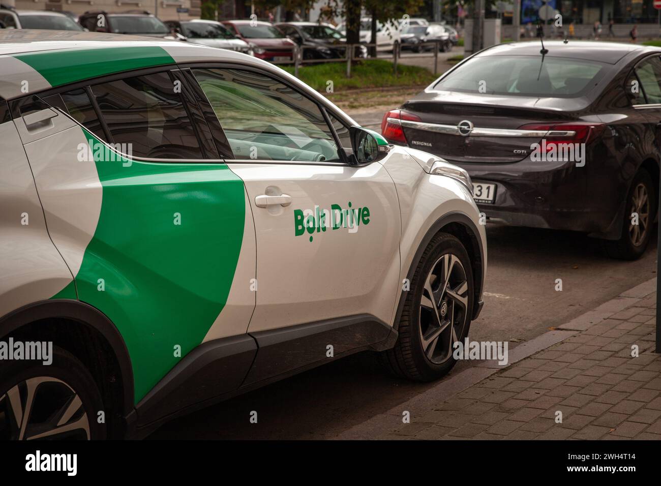 Picture of a sign with the logo of Bolt drive on a SUV ready for rent ...