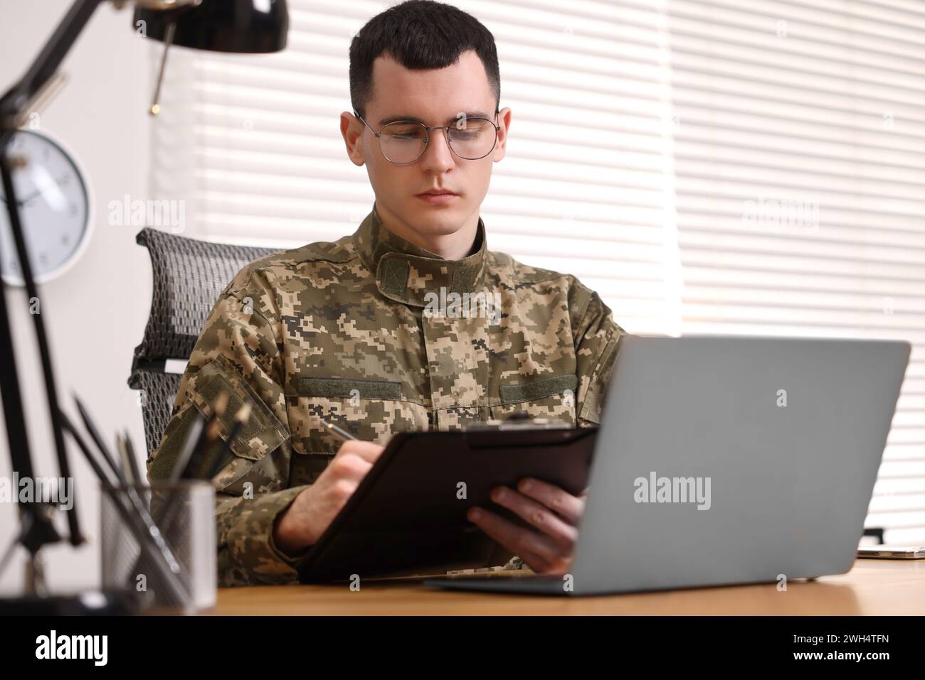 Young male soldier clipboard hi-res stock photography and images - Alamy