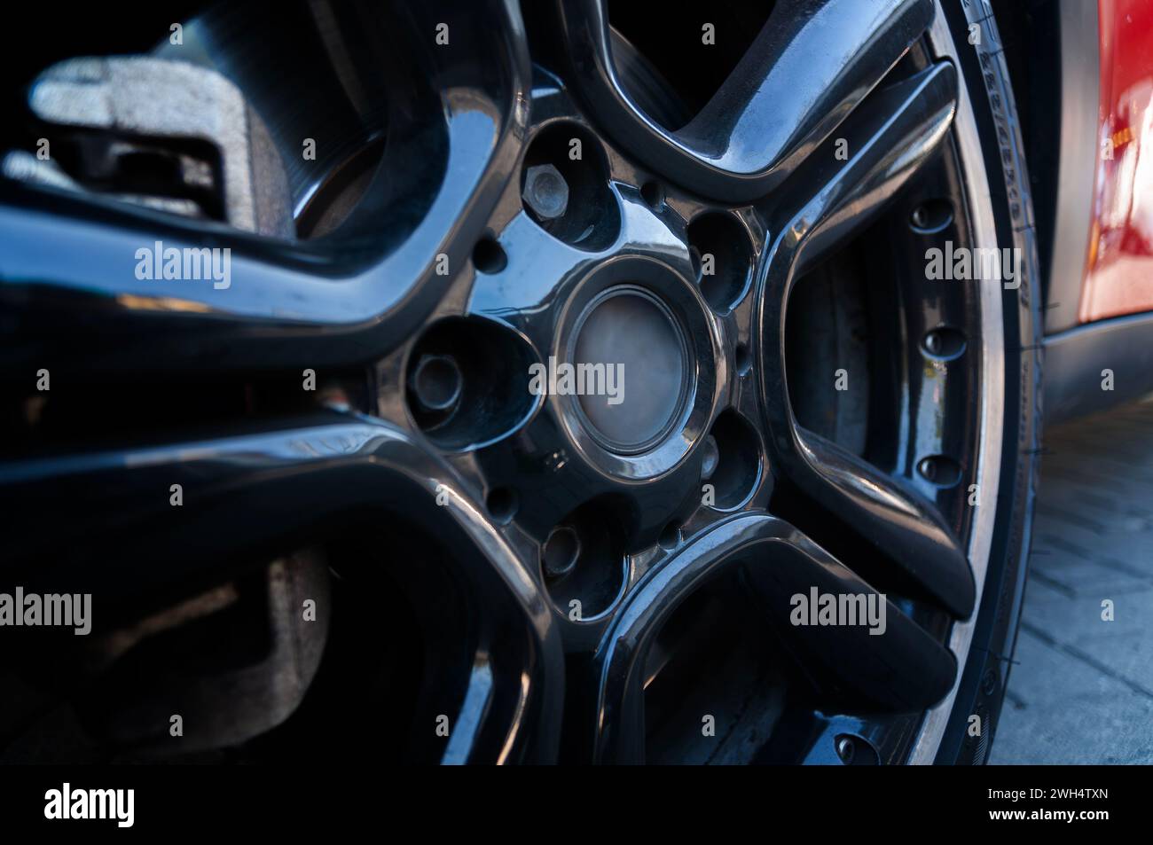 The car's wheel or rim is made of metallic black aluminum alloy Stock ...