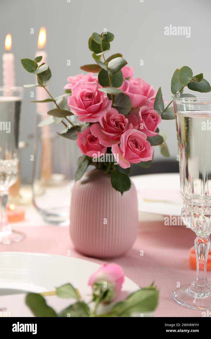 Romantic dinner. Bouquet with beautiful pink roses on table Stock Photo ...