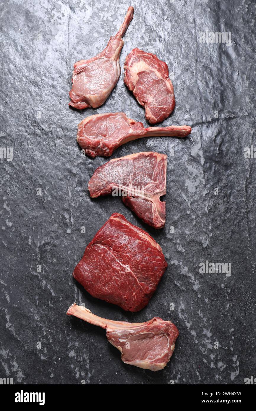 Fresh raw beef cuts on grey textured table, flat lay Stock Photo - Alamy