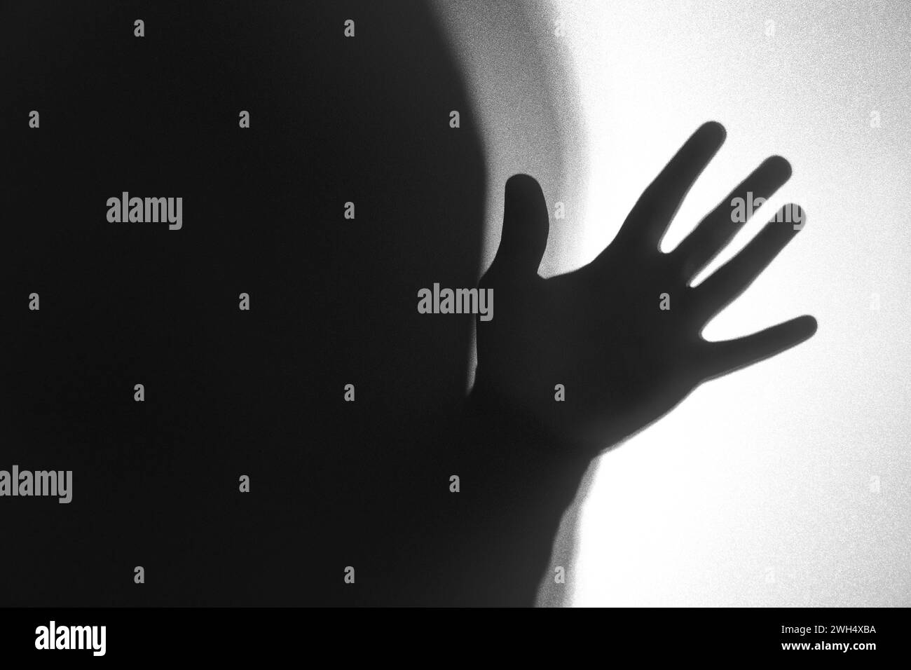 Silhouette of ghost behind glass against white background, closeup ...