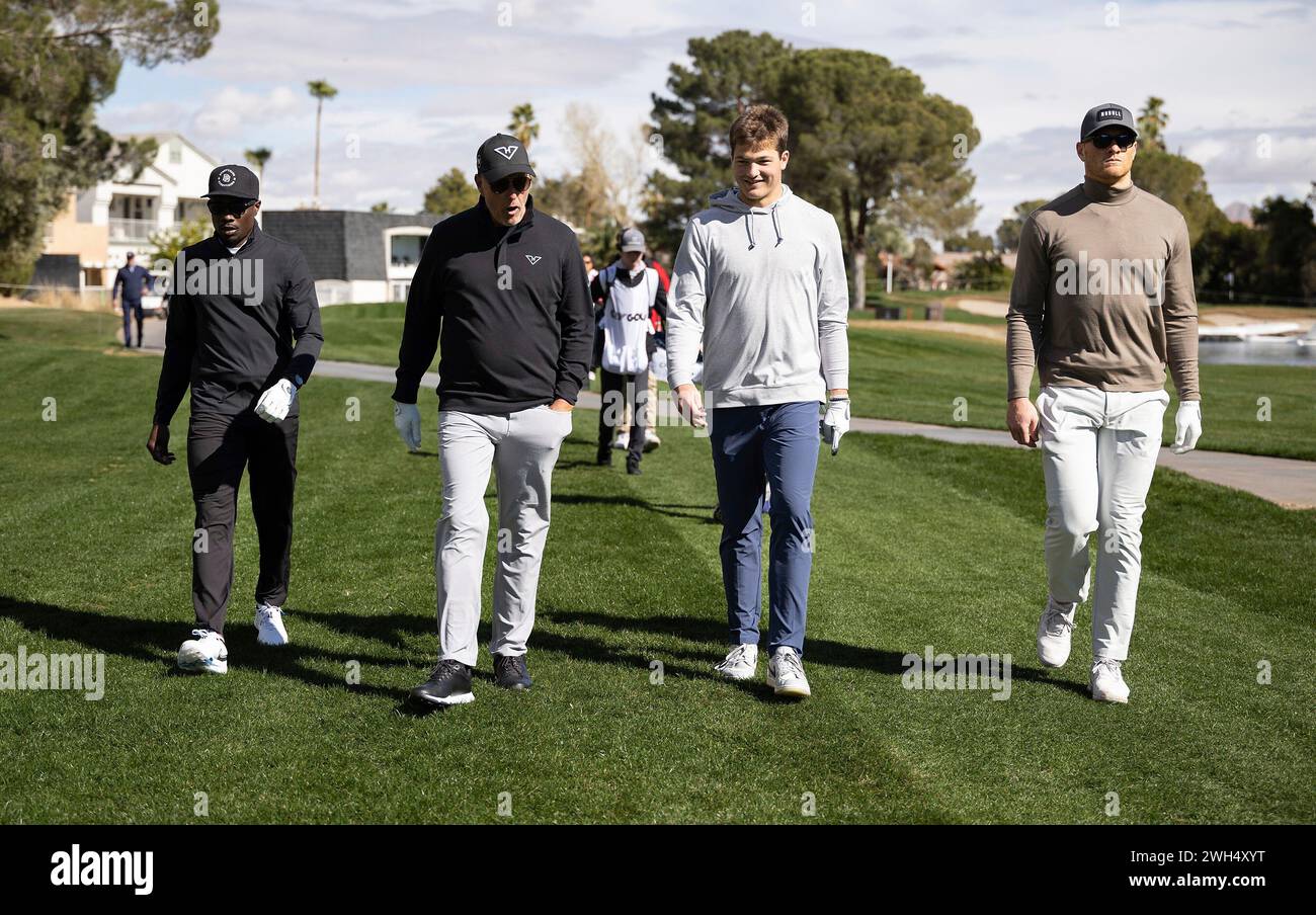 Captain Phil Mickelson of HyFlyers GC walks with Amateurs Darius Butler ...