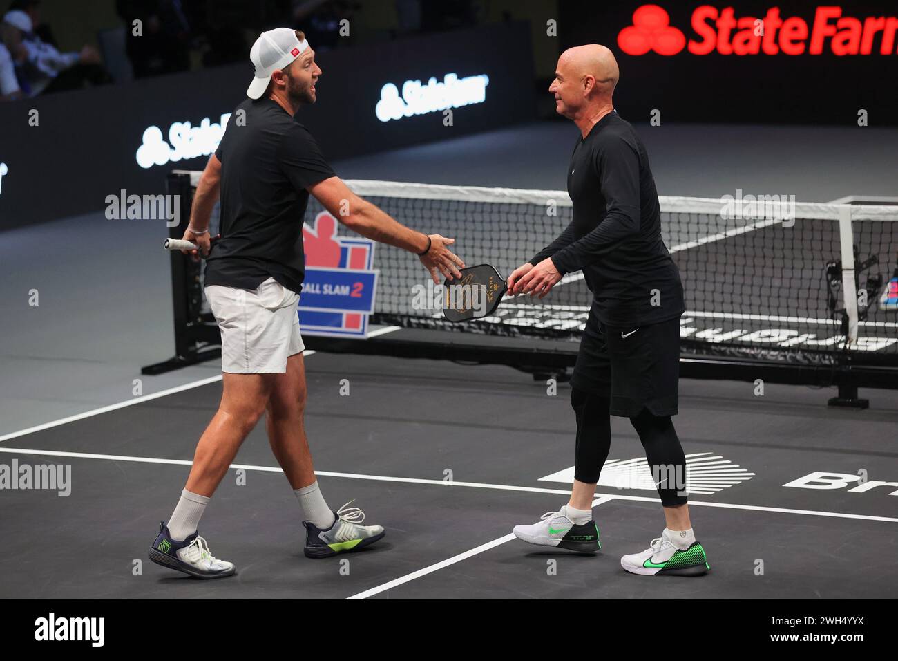 Jack Sock and Andre Agassi celebrate a point at Hard Rock Live at ...