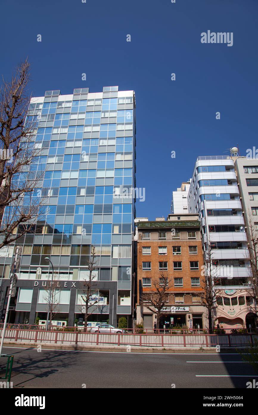 Modern blue glass building in Gina, Tokyo, Japan Stock Photo - Alamy