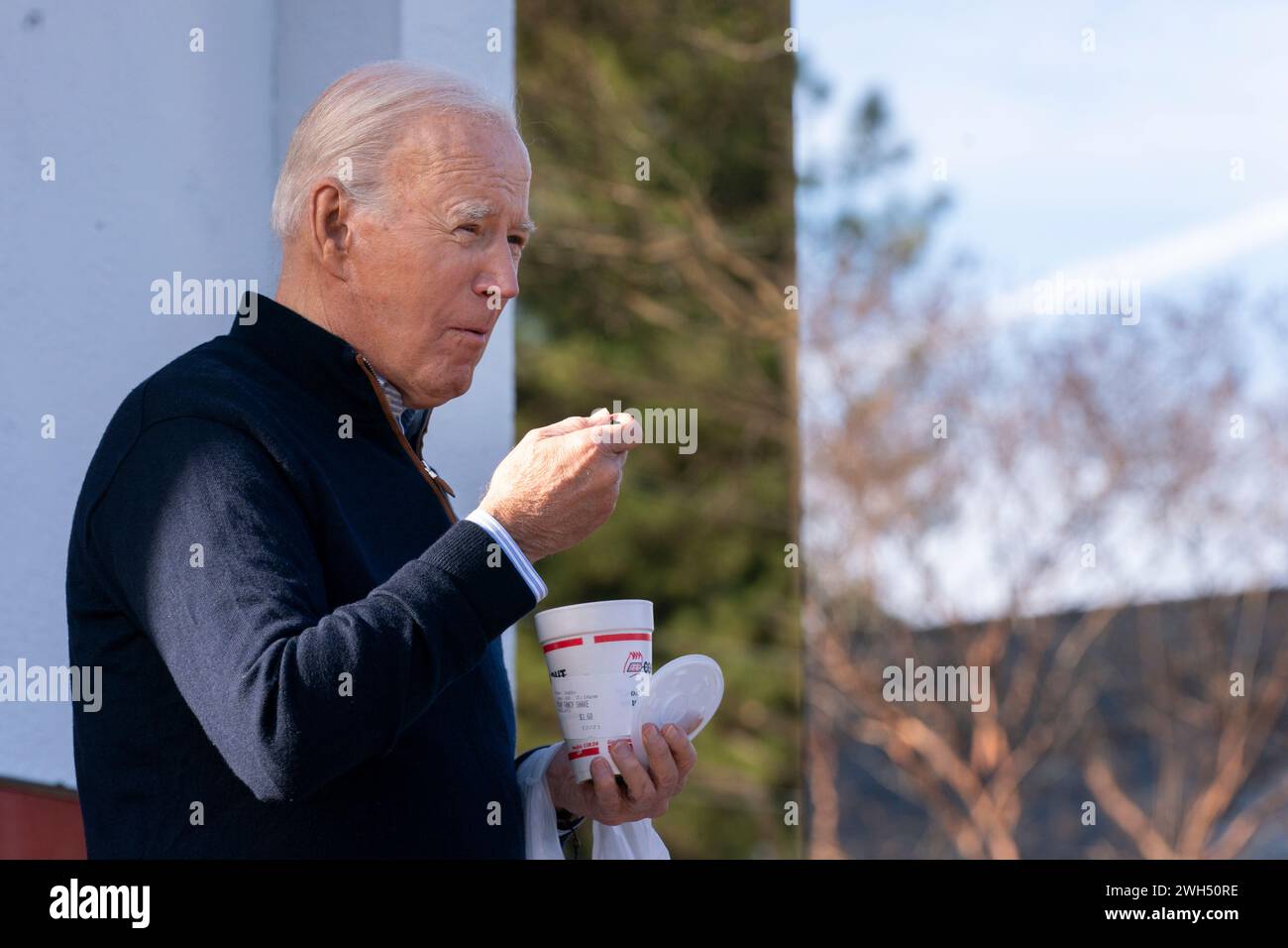 President Joe Biden walks with his food order from the take out window ...