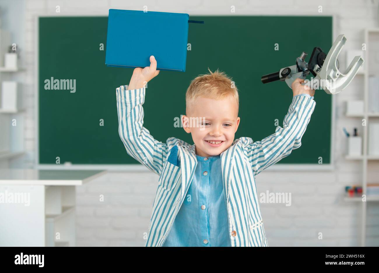 School boy studying math on lesson in classroom at elementary school ...