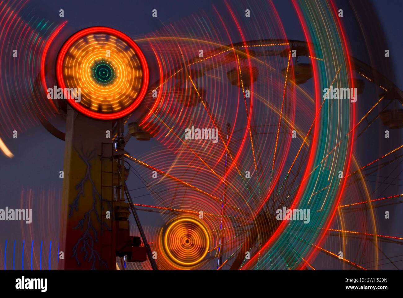 Kamikaze and Sinbad carnival rides with ferris wheel, Oregon State Fair ...