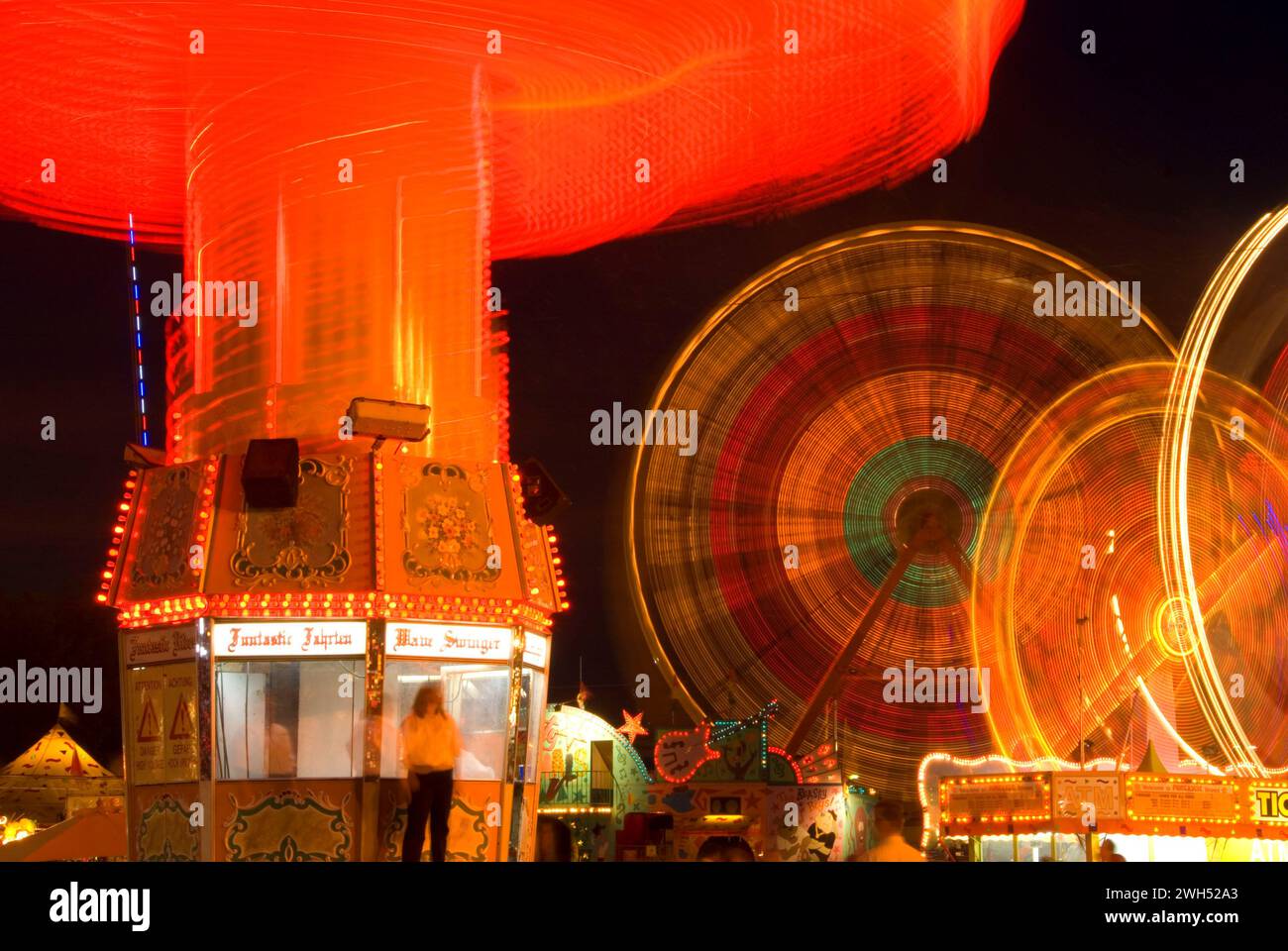 Wave Swinger carnival ride with ferris wheel, Oregon State Fair, Salem ...