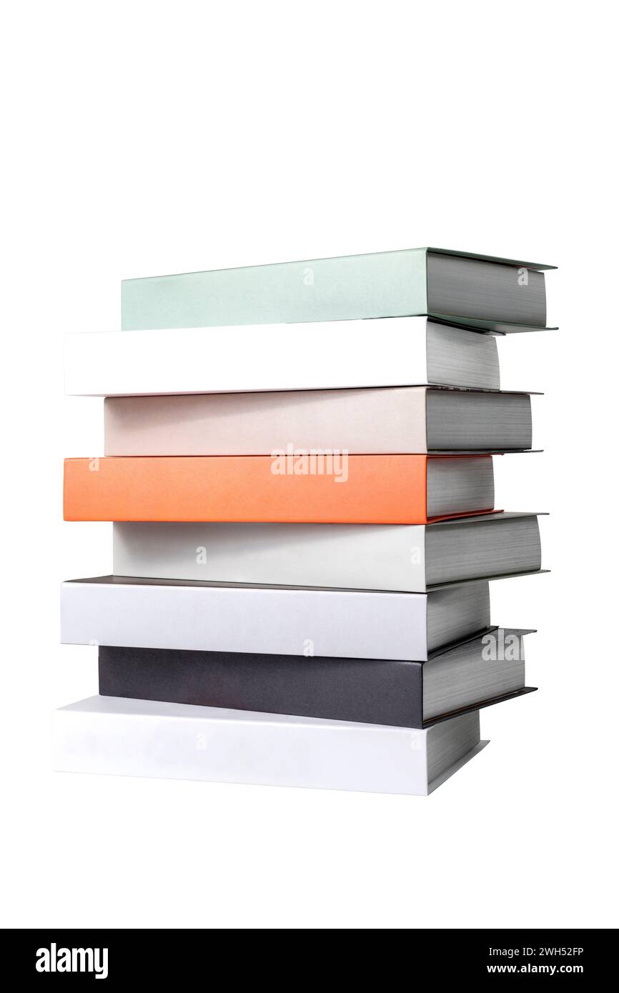 A stack of hardcover books is isolated over a white background ...