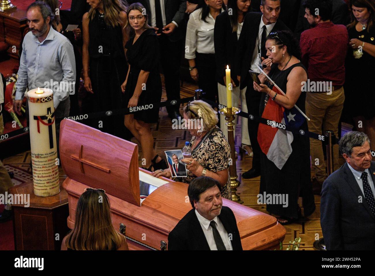 Santiago, Chile. 7th Feb, 2024. A woman mourns by the coffin of former ...
