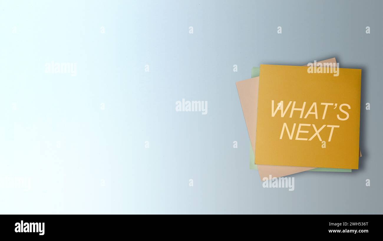 Stack of note paper with 'What's next' text over colored background ...