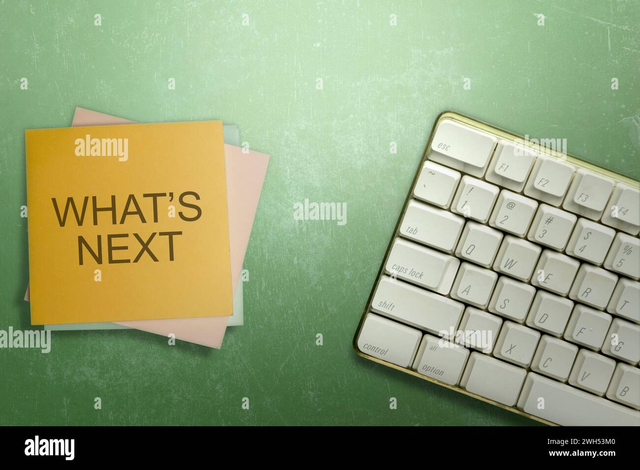 Stack of note paper with 'What's next' text over colored background ...