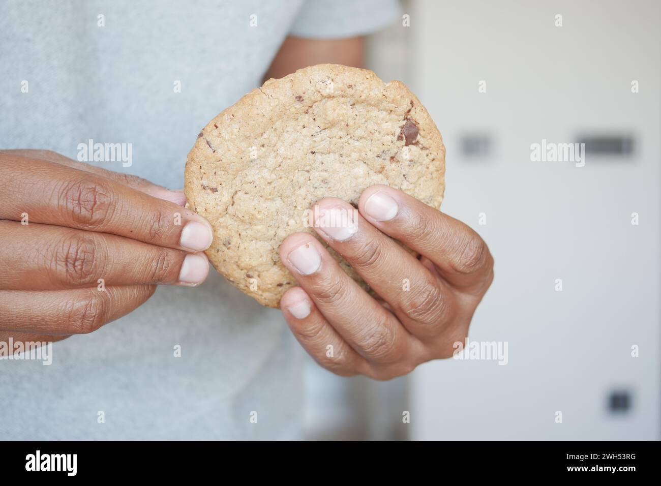 men hand breaking sweet cookies Stock Photo - Alamy