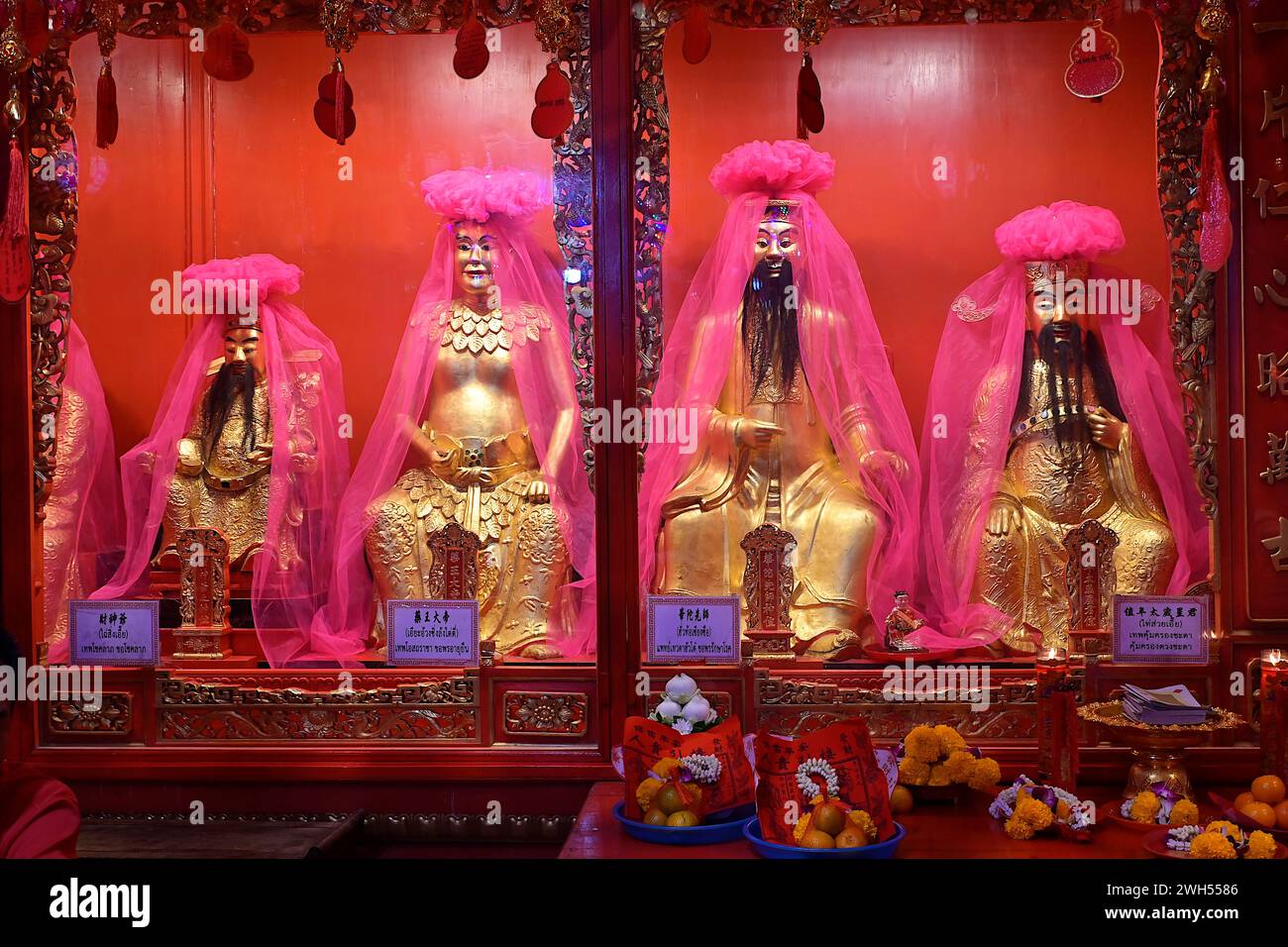 Taoist shrine with images of key deities including Cai Shen, Yao Wang ...