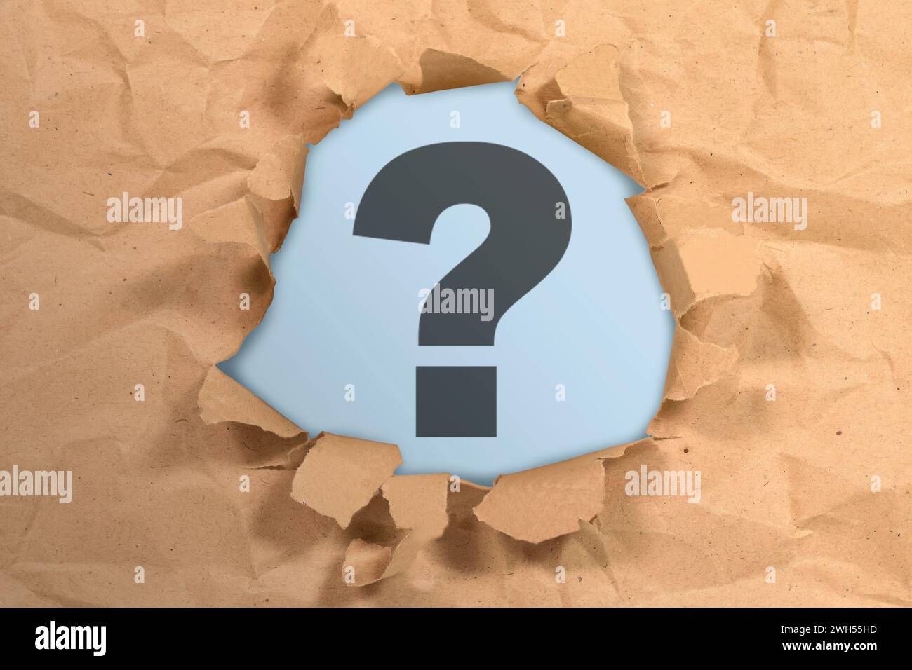 Ripped paper with question mark symbol. Quiz concept Stock Photo - Alamy