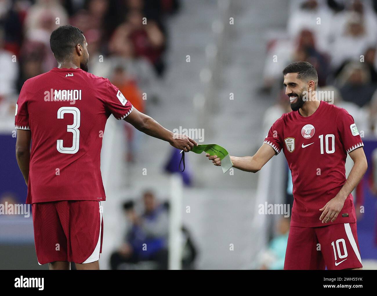 Doha, Qatar. 7th Feb, 2024. Qatar's Hasan Al Haydos (R) substitutes ...