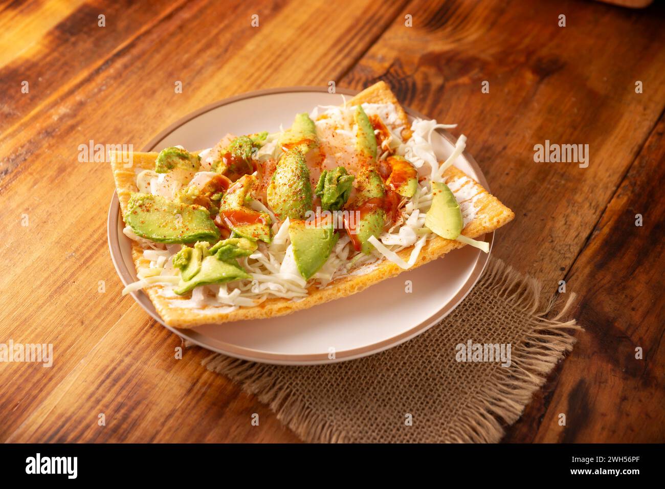 Fried wheat flour toast with pickled pork skin, sour cream and ...
