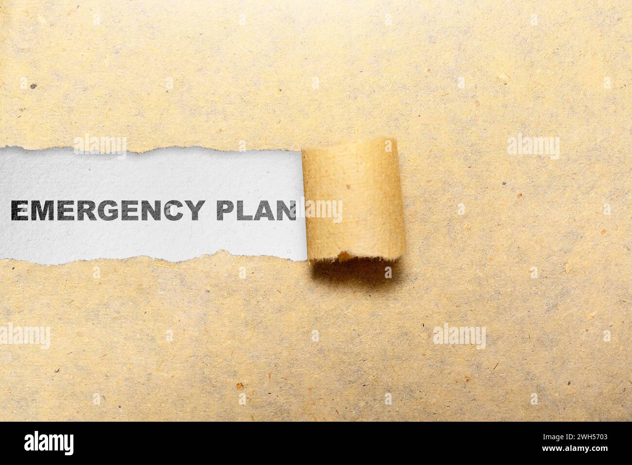 Ripped paper with 'Emergency plan' text with a white background ...