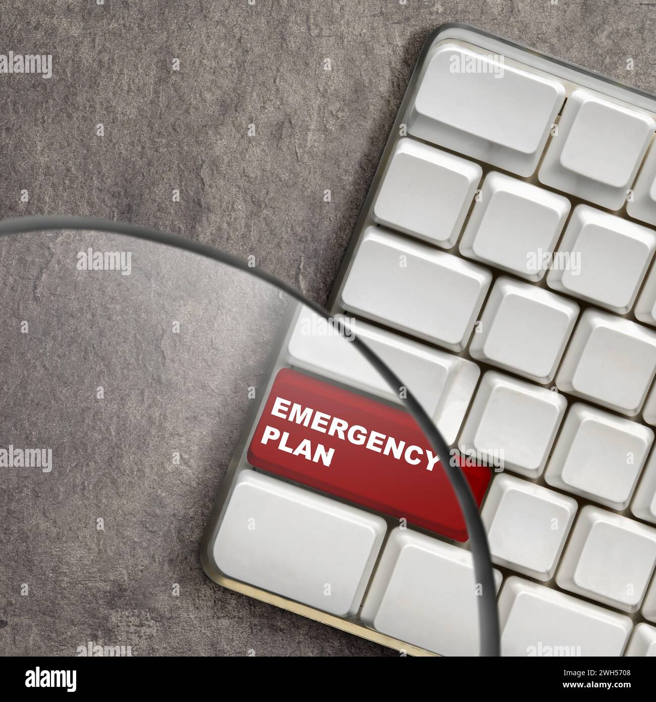 The magnifying glass focuses on the keyboard button with 'Emergency ...