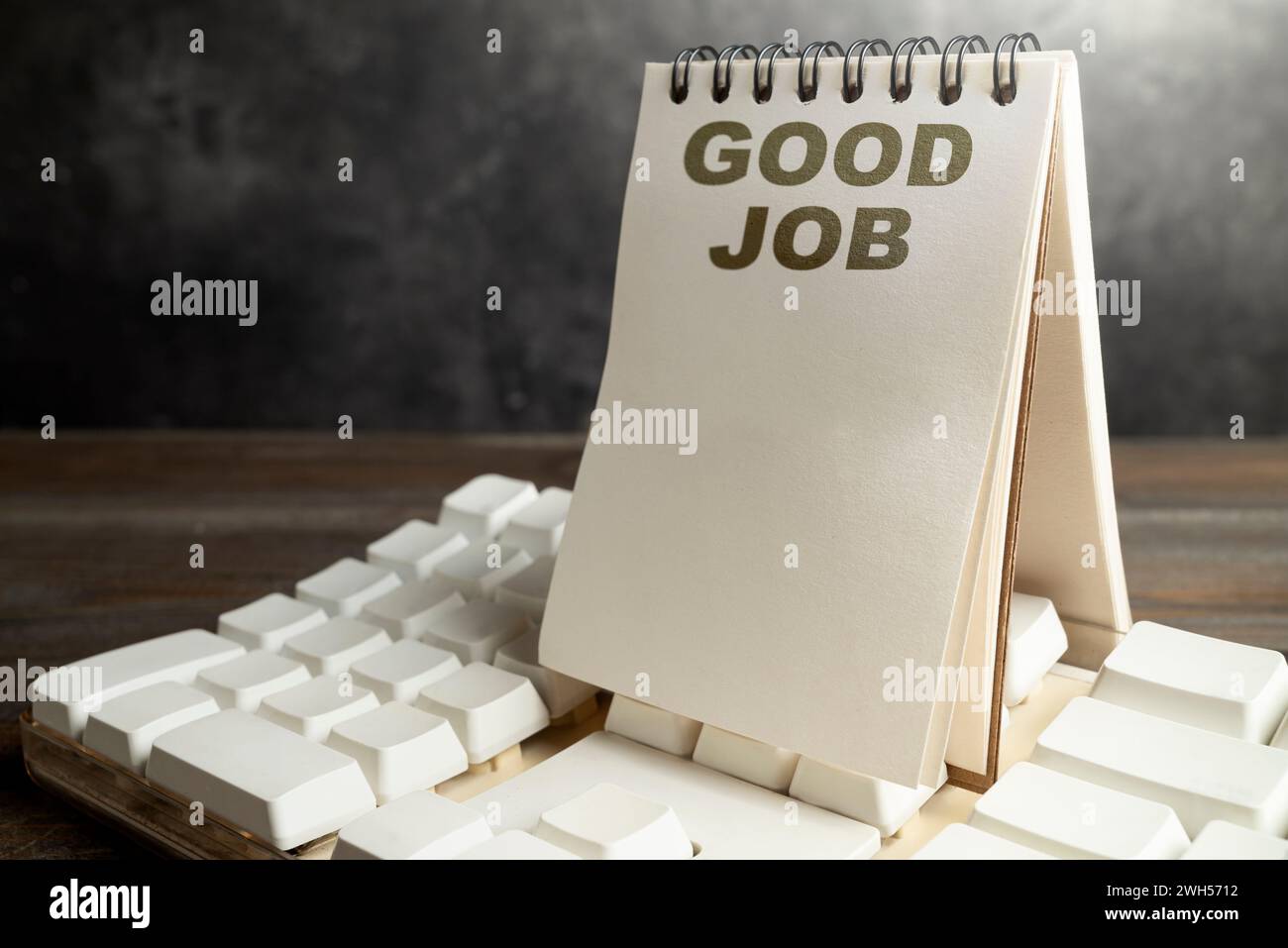 Note with 'Good job' text on a black background. Appreciation concept ...