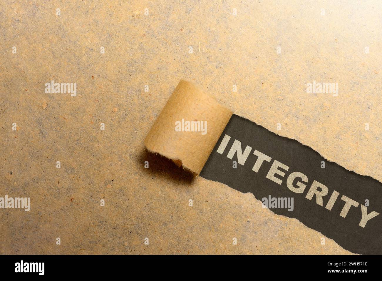 Ripped paper with integrity text on a black background. Reputation ...