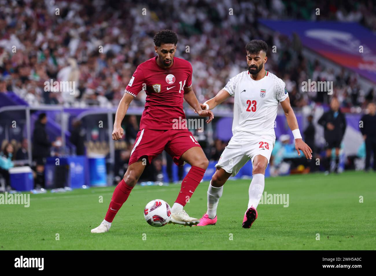 Doha, Qatar. 7th Feb, 2024. (L to R) Homam Alamin AHMED (QAT), Ramin REZAEIAN (IRI) Football ...