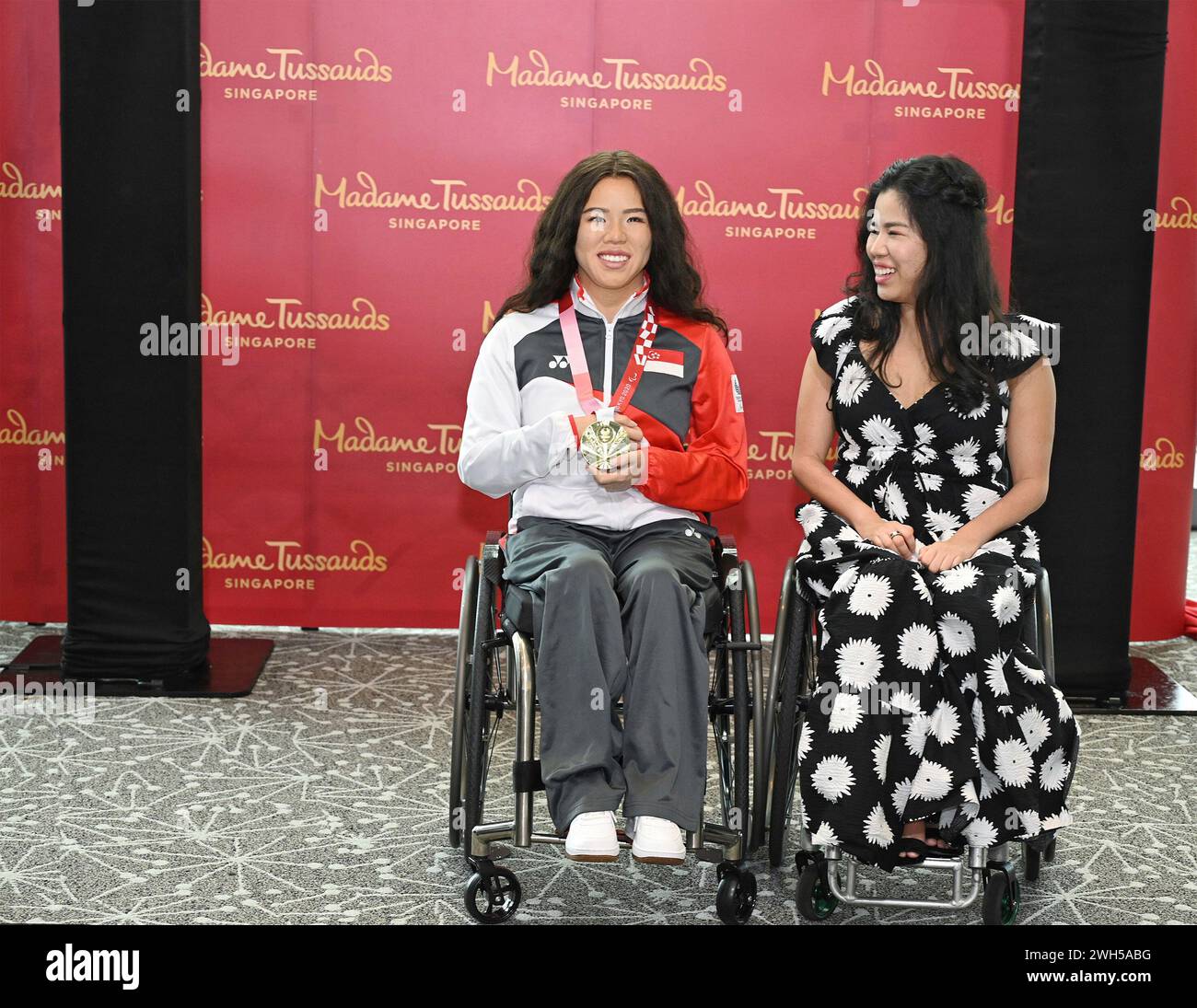 Singapore's five-gold Paralympic swimmer Yip Pin Xiu posing with Madame ...