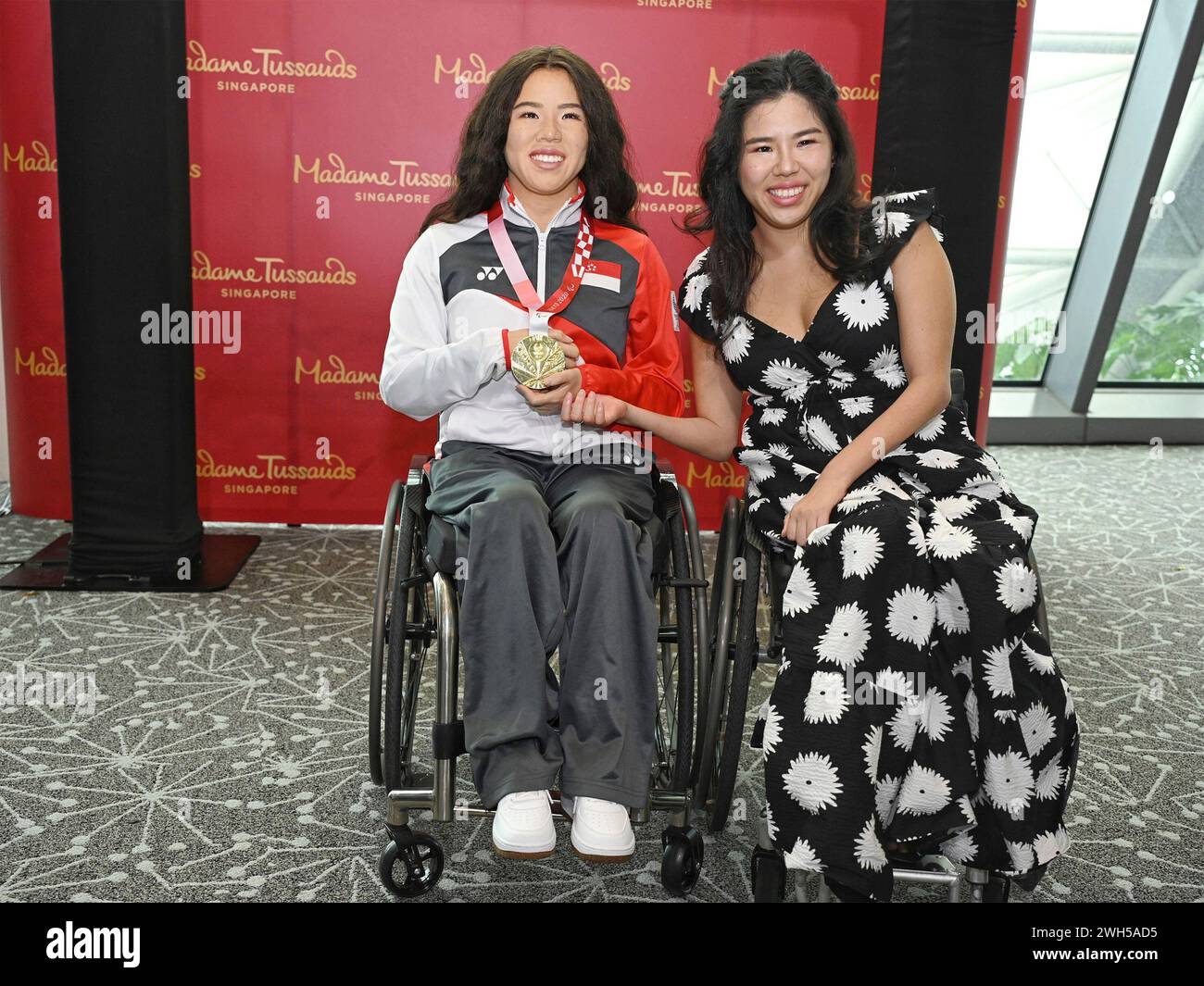 Singapore's five-gold Paralympic swimmer Yip Pin Xiu posing with Madame ...