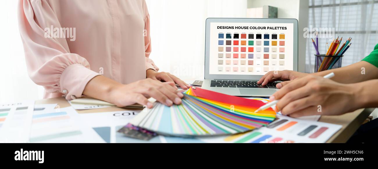 Cropped imaged of professional interior designers choose appropriate ...