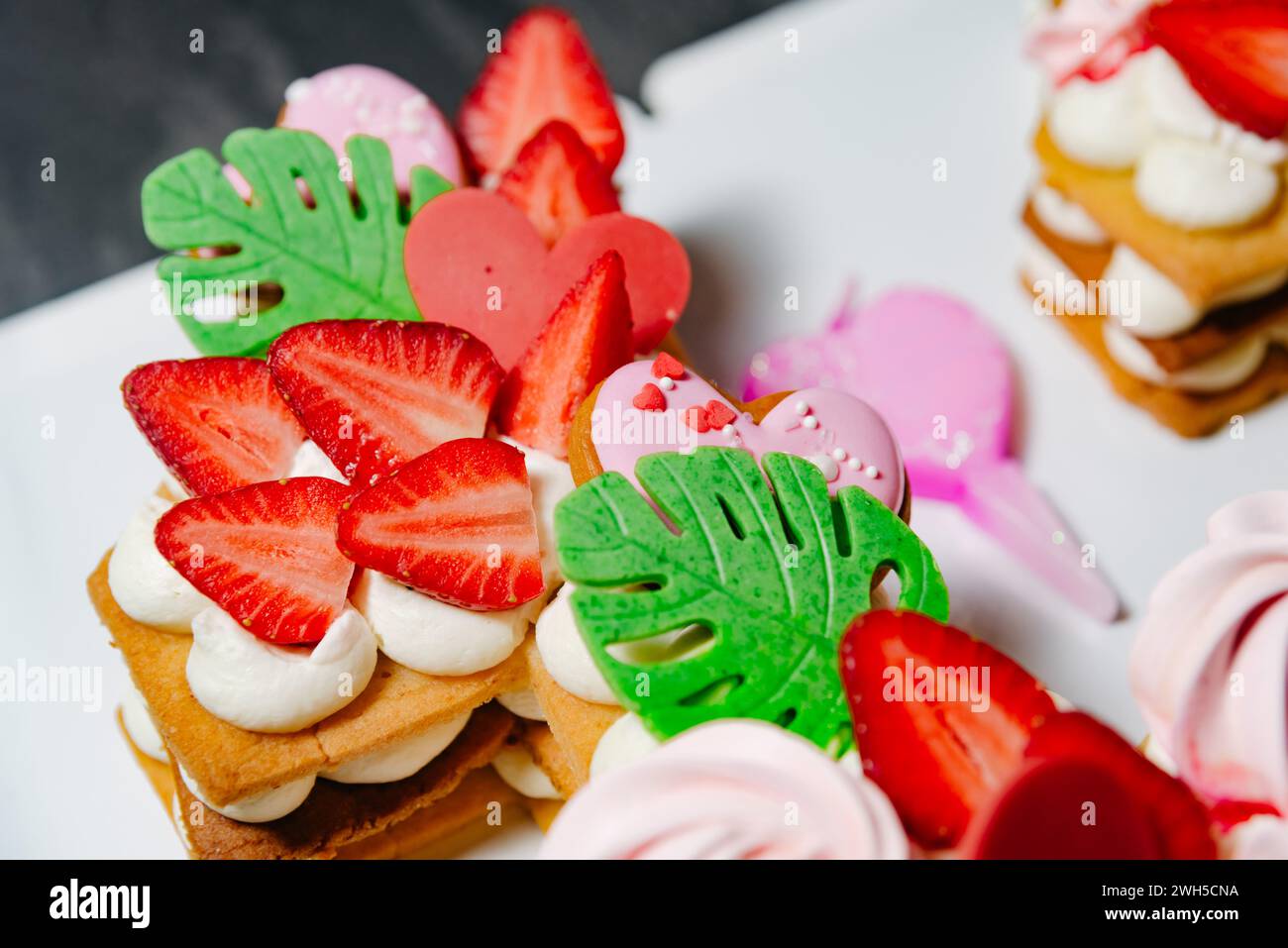 Close-up of a delicious strawberry mille-feuille pastry, decorated with ...