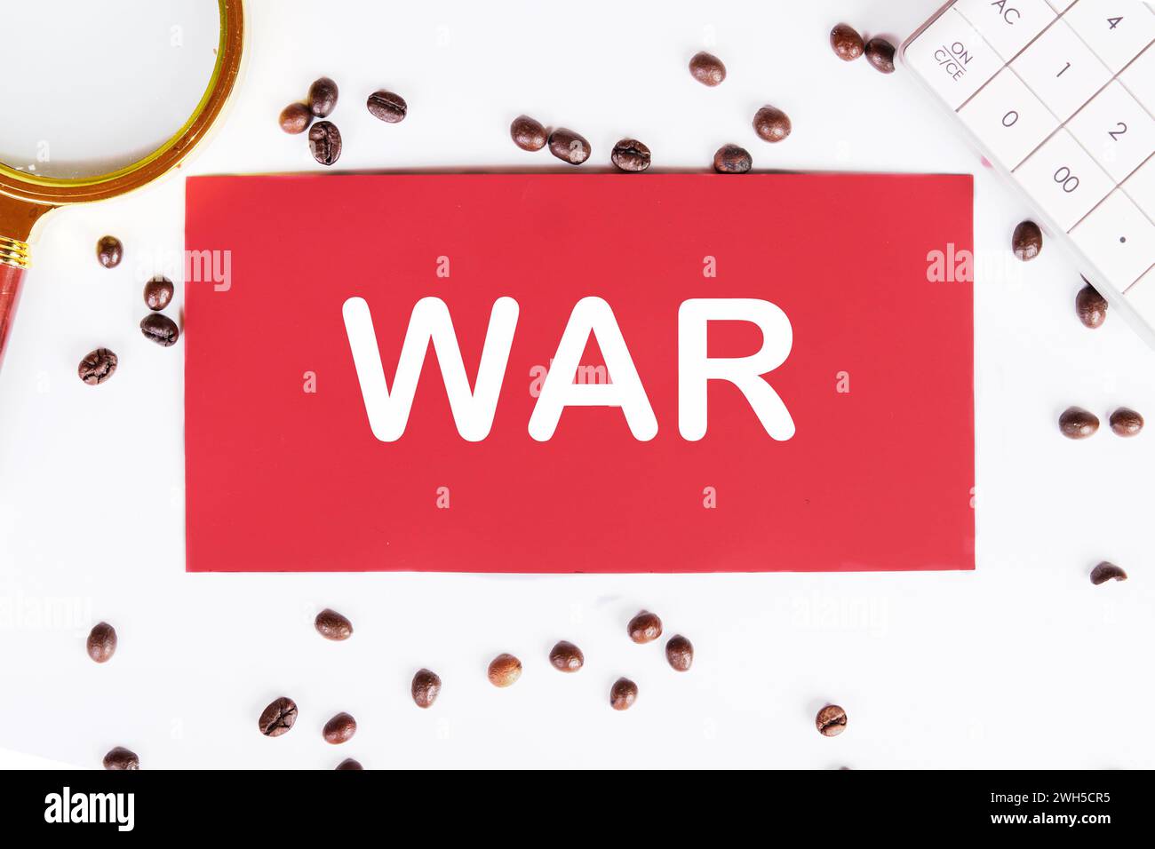 WAR writing on a red card on a white background with coffee beans and a ...