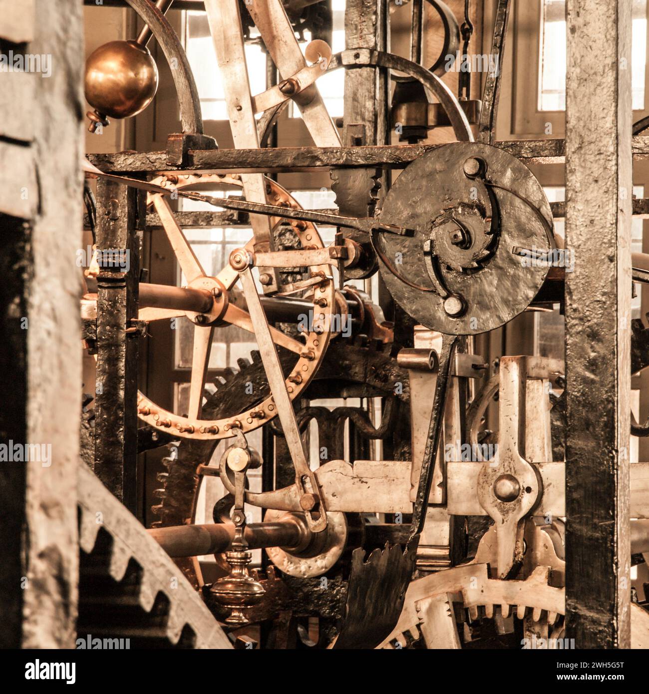 Clockwork mechanism. Close up view of cog wheels and other mechanical ...