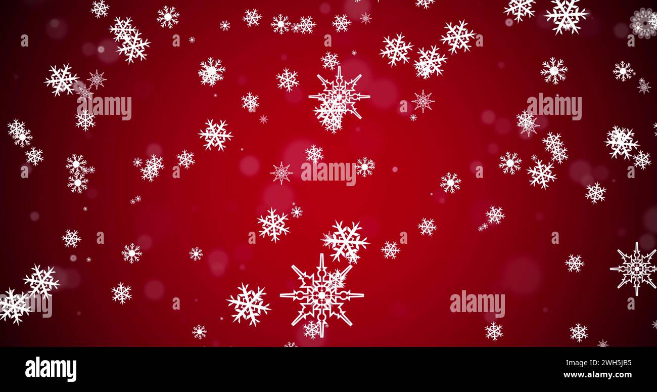 Image of christmas snow falling on red background Stock Photo - Alamy