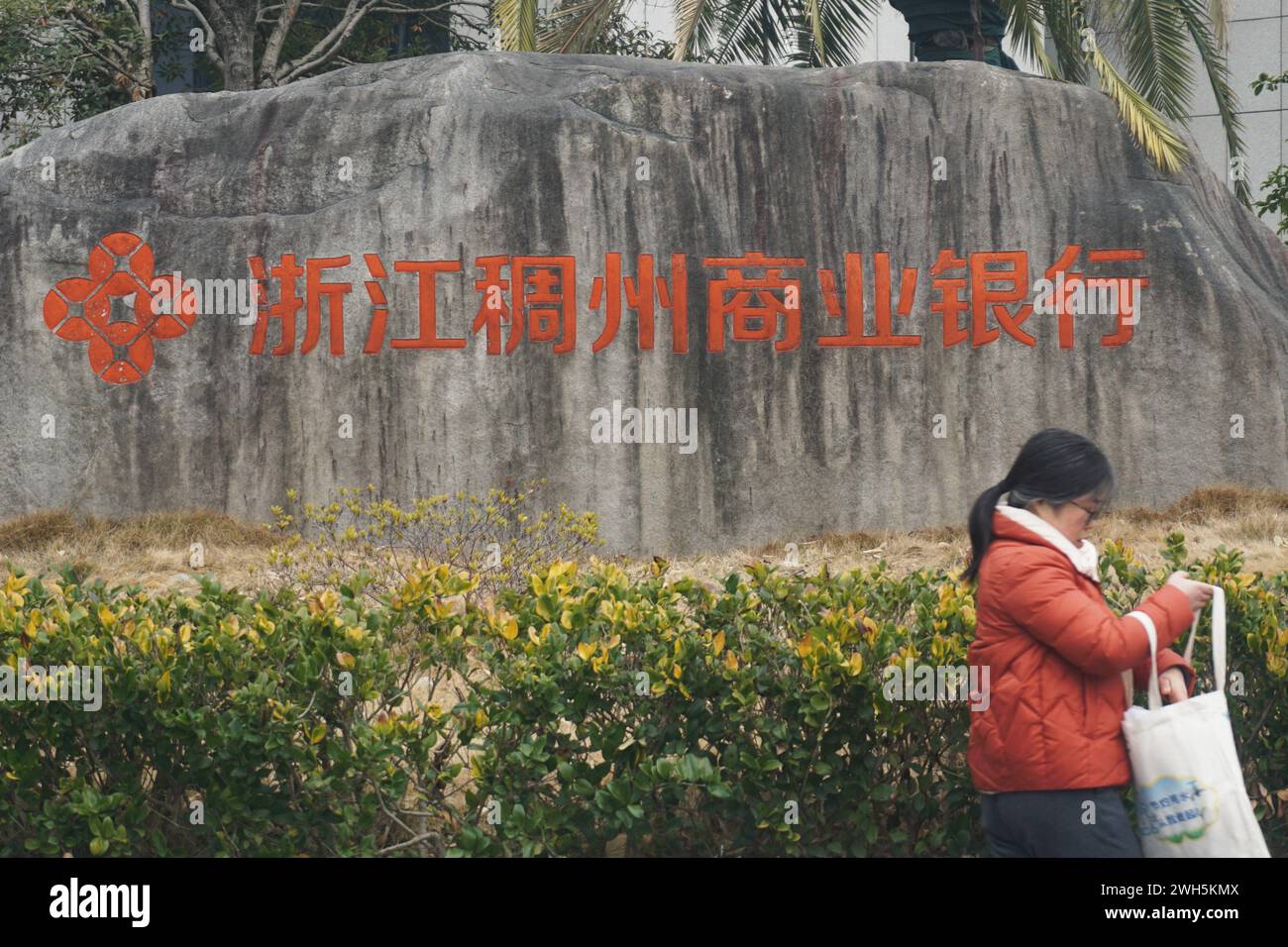 HANGZHOU, CHINA - FEBRUARY 8, 2024 - A citizen walks past the ...