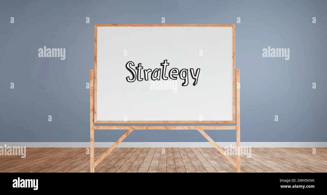 Strategy text on whiteboard in a room with grey walls and wooden floor ...