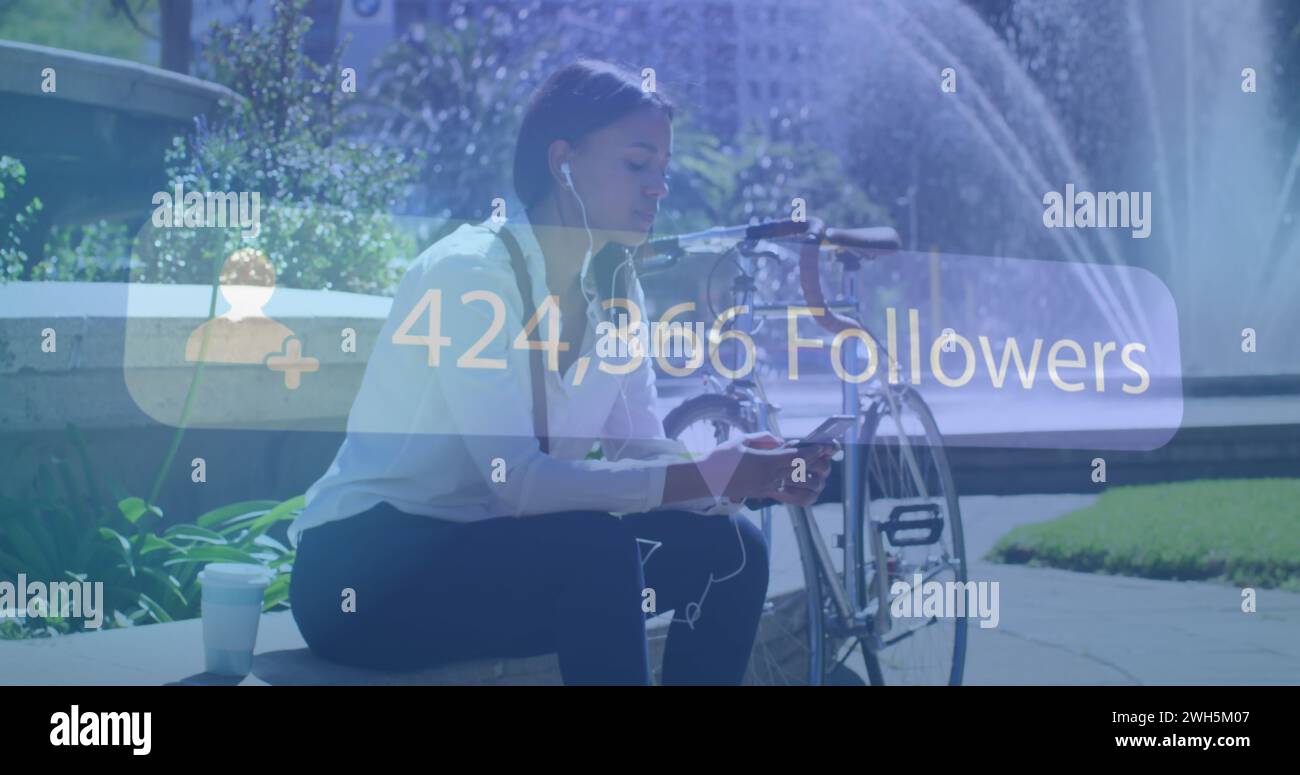 Image of followers text and numbers on blue speech bubble over woman using smartphone Stock ...