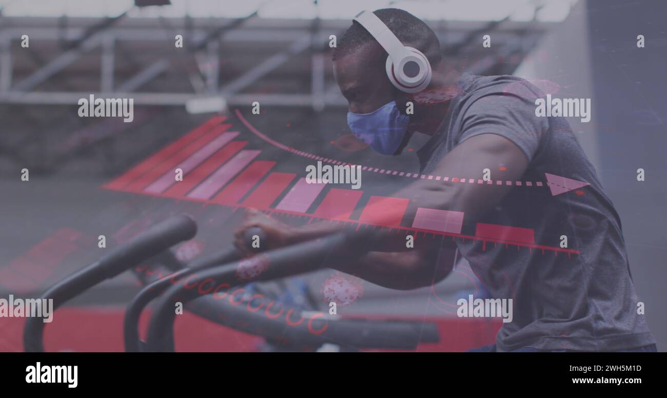 Image of graphs and statistics over african american man wearing face ...