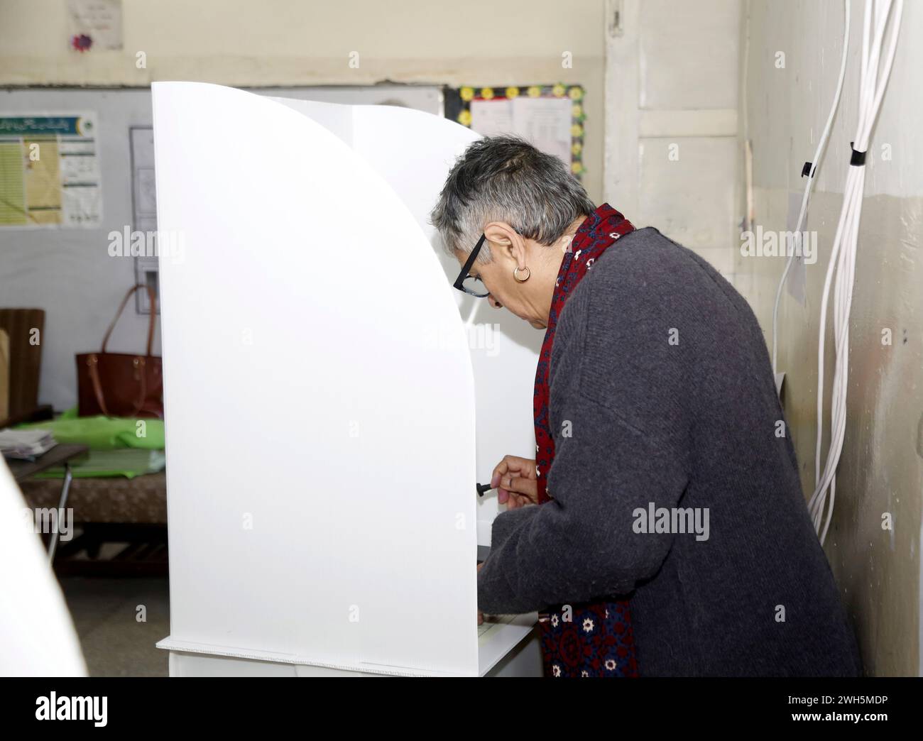 Islamabad. 8th Feb, 2024. A woman casts her vote at a polling station ...