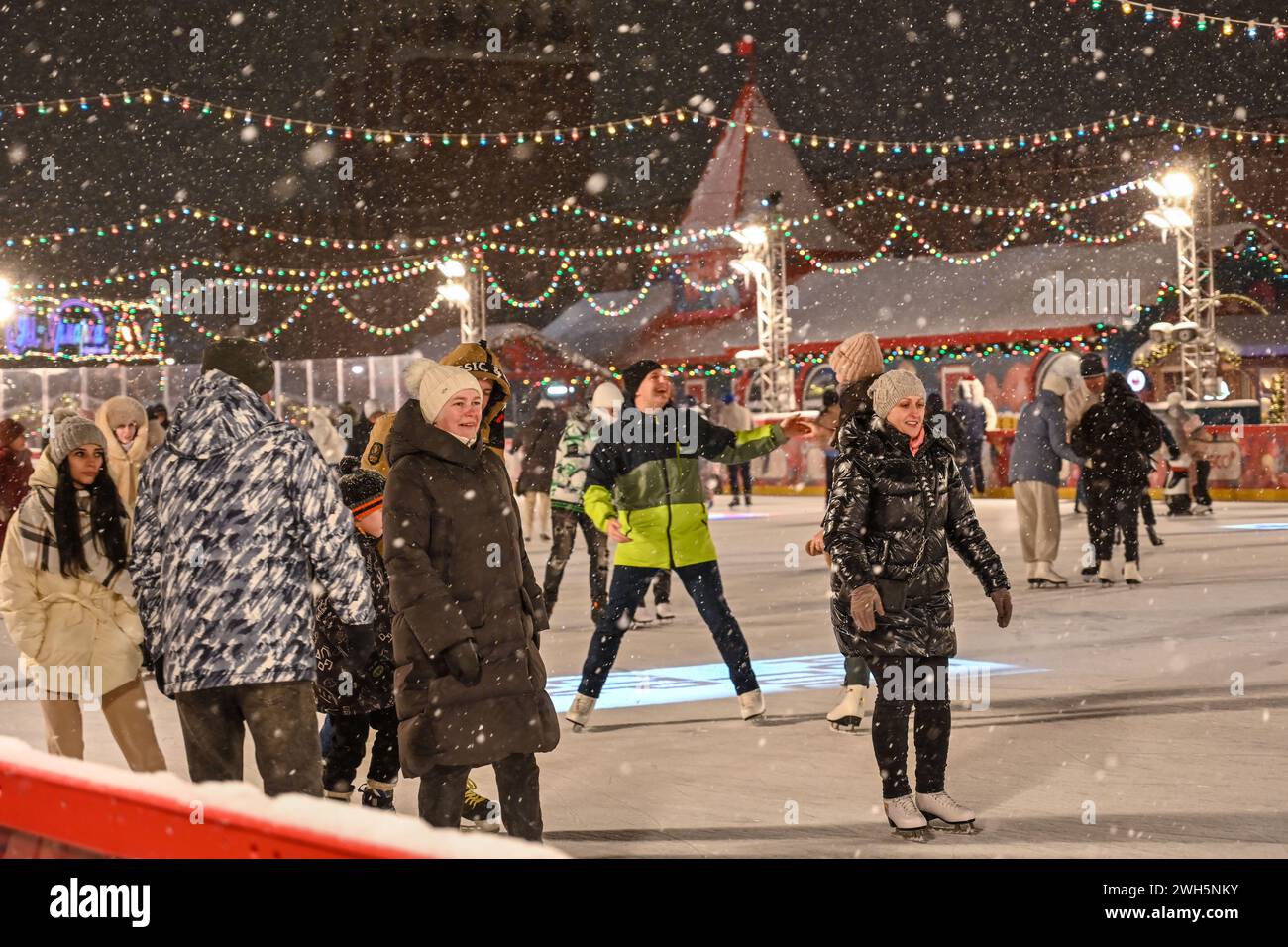 Moscow, Russia. 7th Feb, 2024. People skate at an outdoor ice skating ...