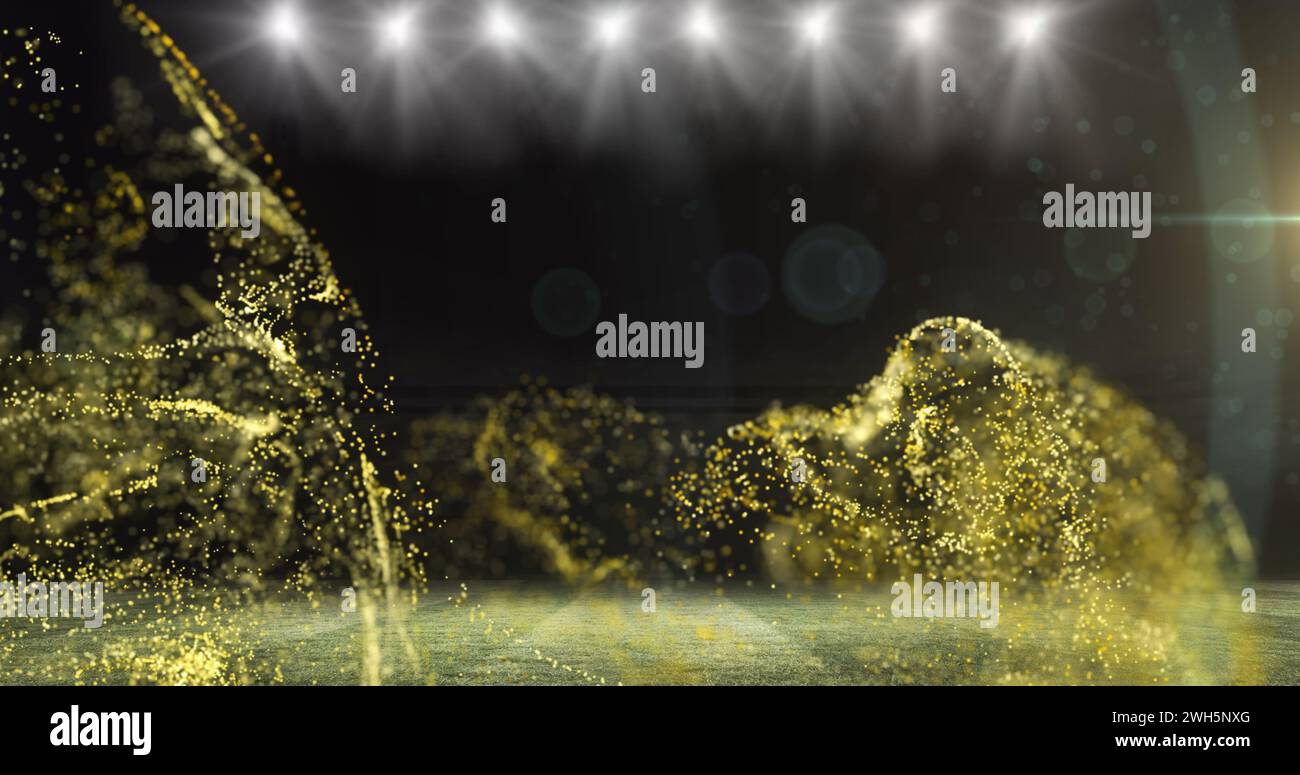Image of golden particles moving over floodlit room Stock Photo - Alamy
