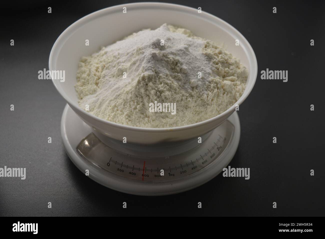 Homemade, tabletop, white weights with wheat flour are located on the ...