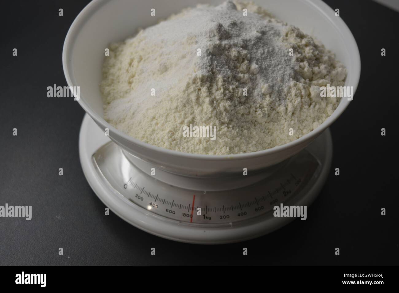 Homemade, tabletop, white weights with wheat flour are located on the ...