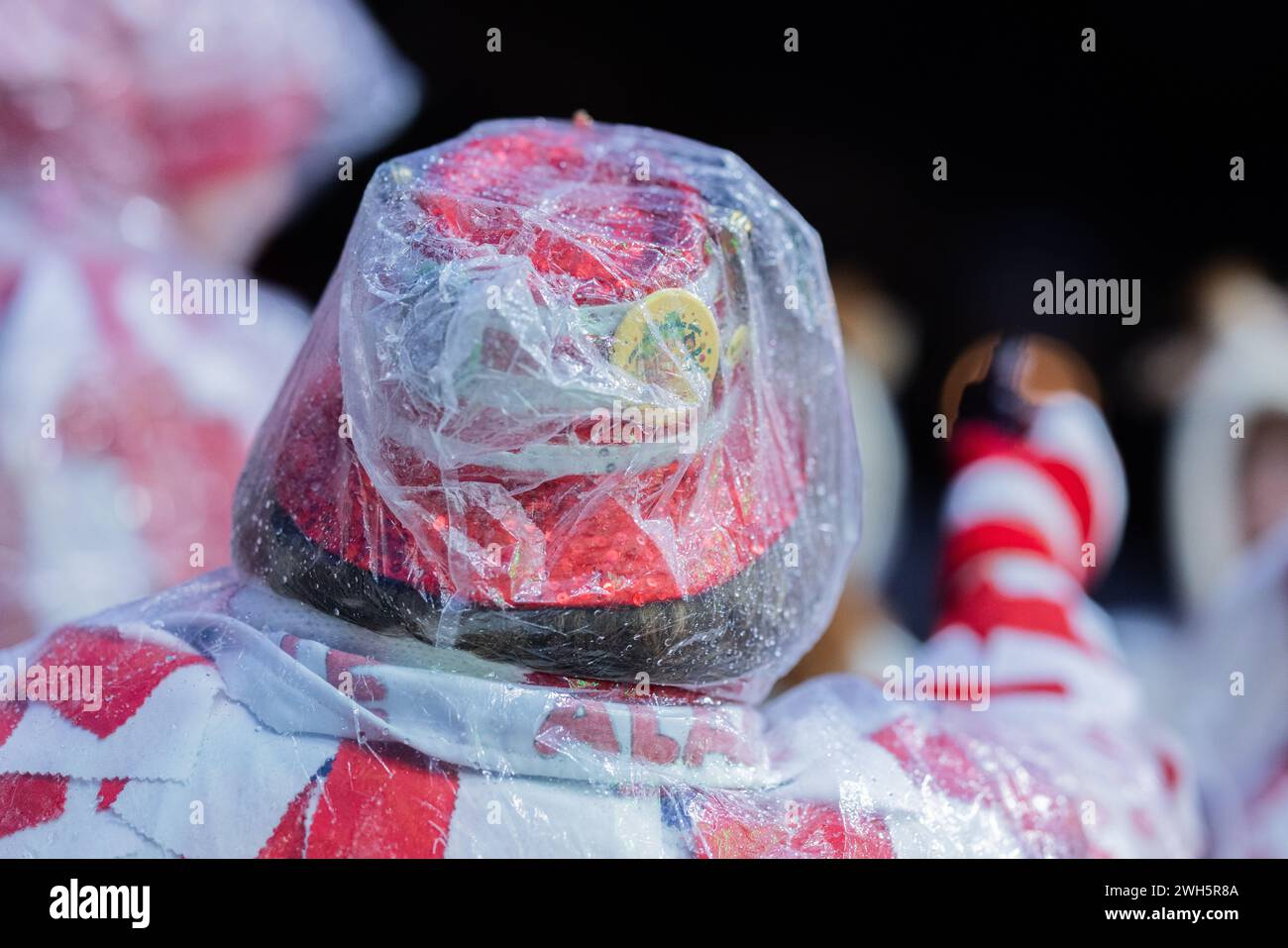 Cologne, Germany. 08th Feb, 2024. Carnival revellers with rain ...