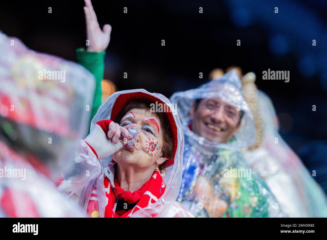 Cologne, Germany. 08th Feb, 2024. Carnival revellers with rain ...