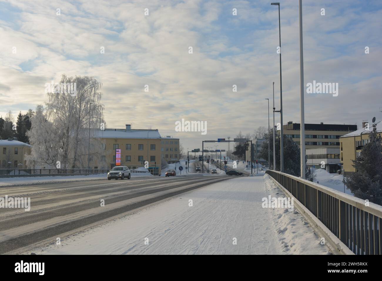 A real snowy Finnish winter in Varkaus, Finland. A Finnish bridge over ...